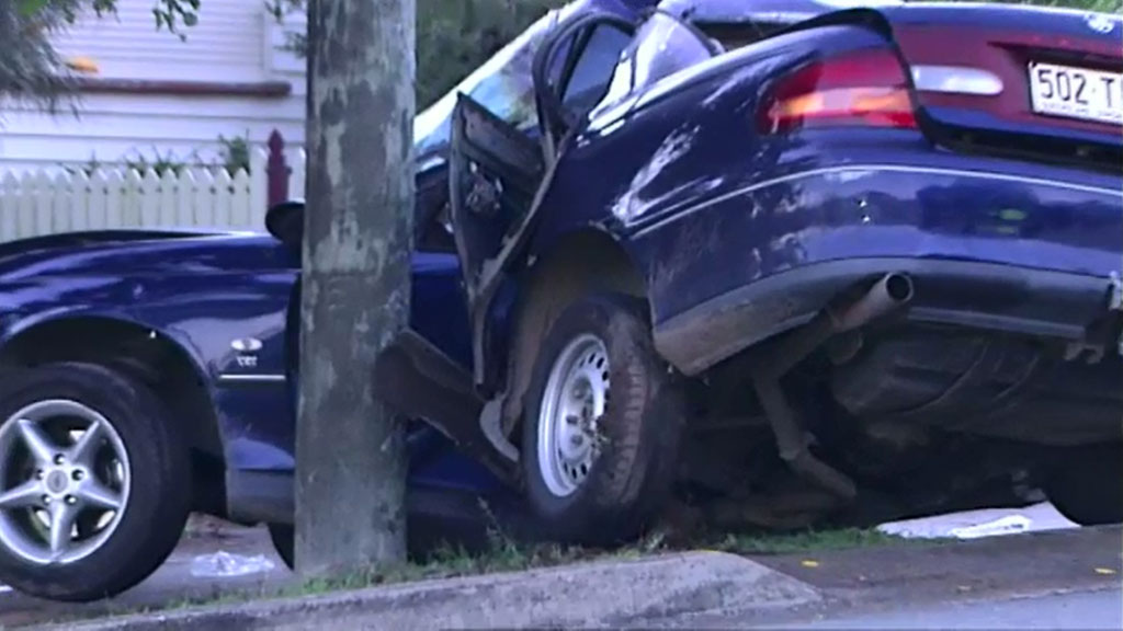 Car wrapped around power pole in Ipswich crash - 9News