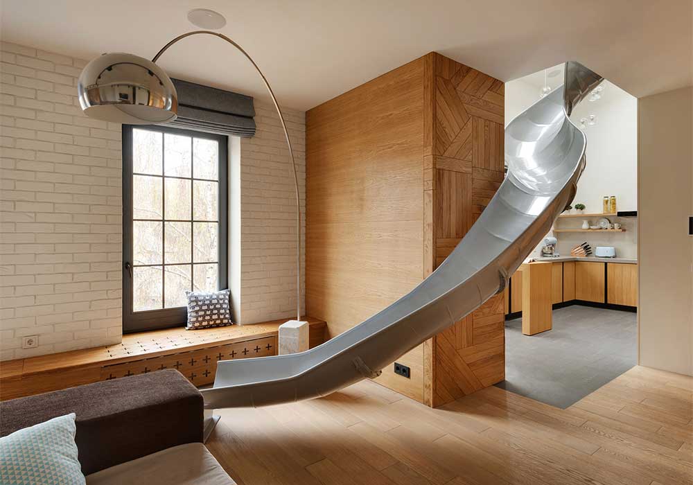 This apartment was designed with a giant slide into the living room ...