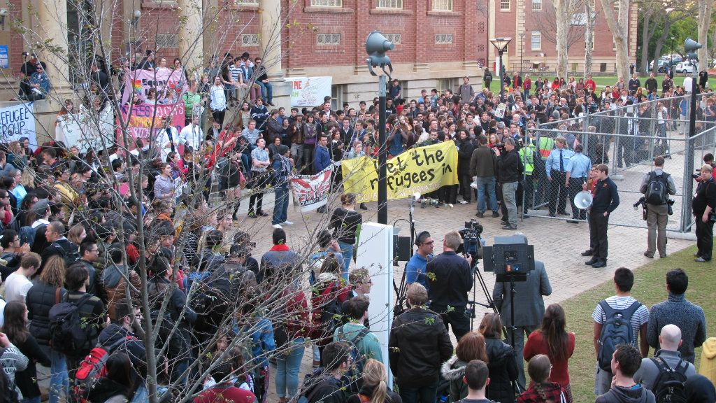 Abbott boasts he's finally attracted more protesters than Christopher Pyne