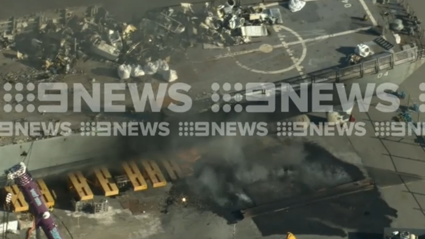 Firefighters battle shipyard blaze