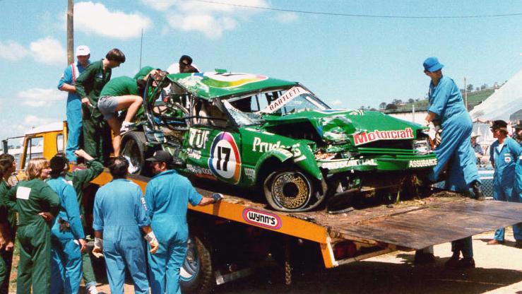Dick Johnson's car returned to the pits on the back of a flatbed after ...