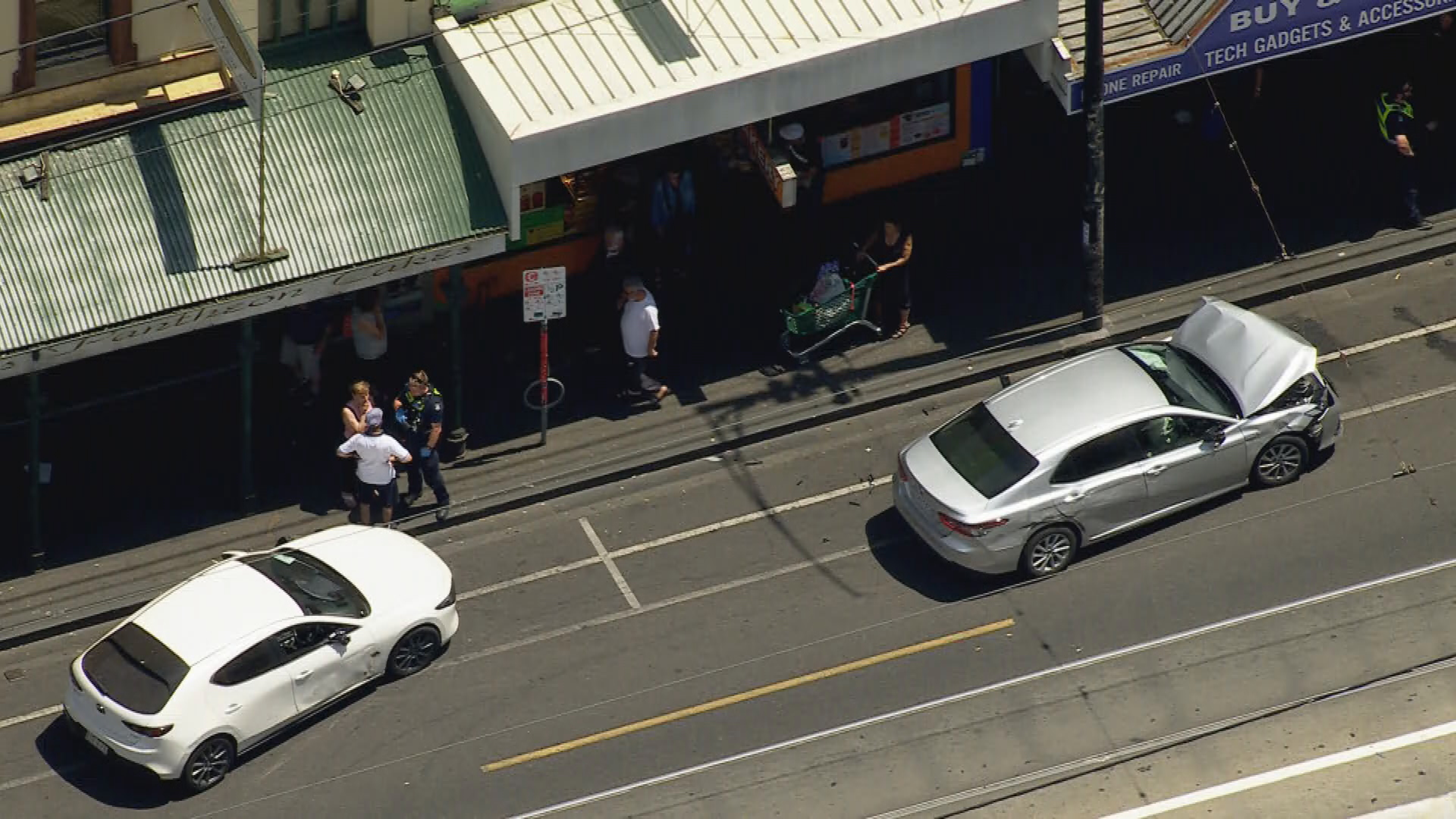 Man restrained by passersby after car crashes into multiple others on ...