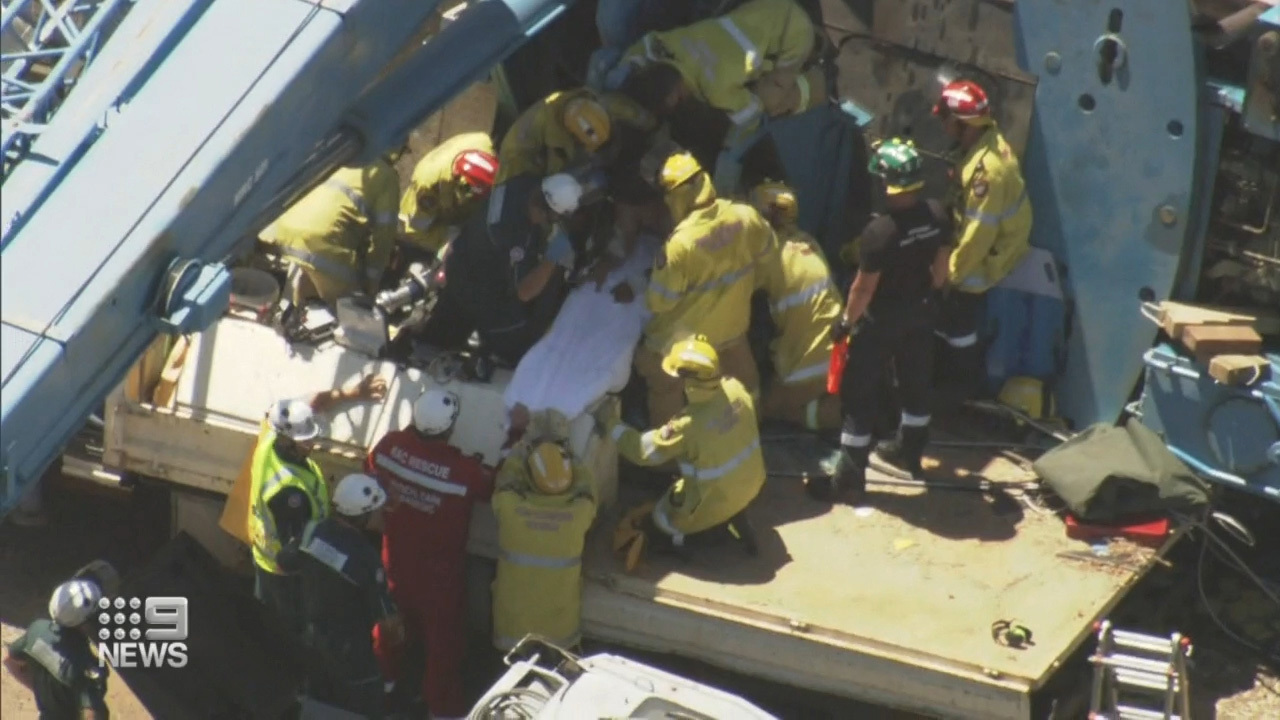 Man seriously injured after becoming trapped inside fallen crane ...